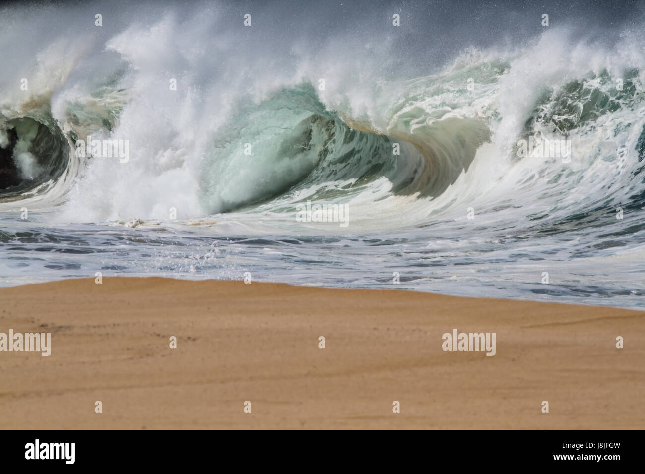 Waimea Bay big shorebreak Ocean wave on the beach on Oahu Hawaii Stock ...