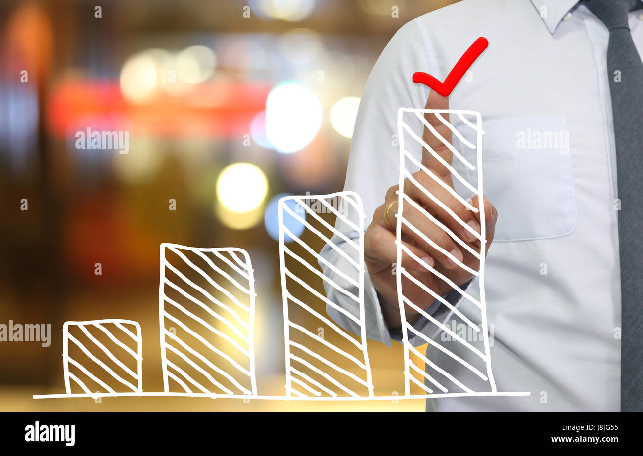 Hand of businessman use finger touch top bar graph in icon Check mark ...