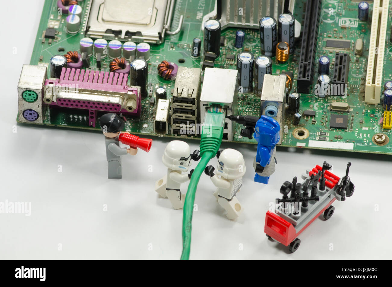 lego storm troopers minifigures plug in internet cable to port on ...