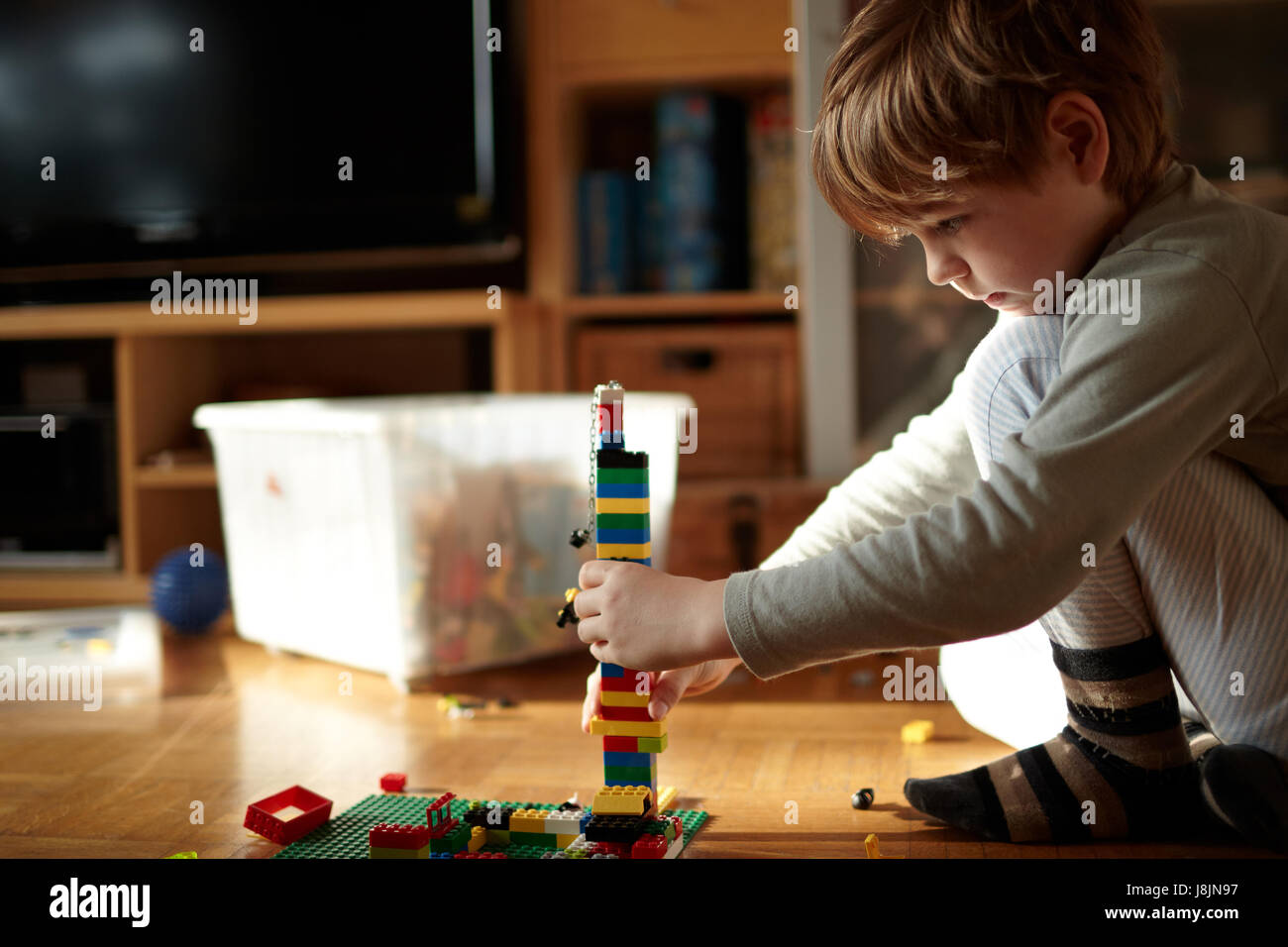 boy builds with lego blocks Stock Photo - Alamy