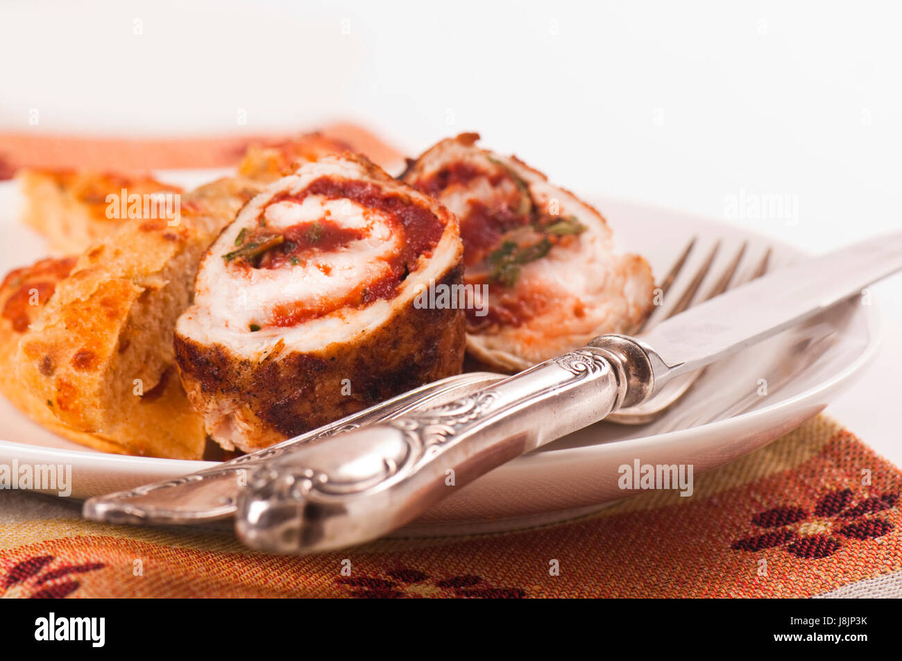 schnitzel role on china plate with white bread Stock Photo - Alamy