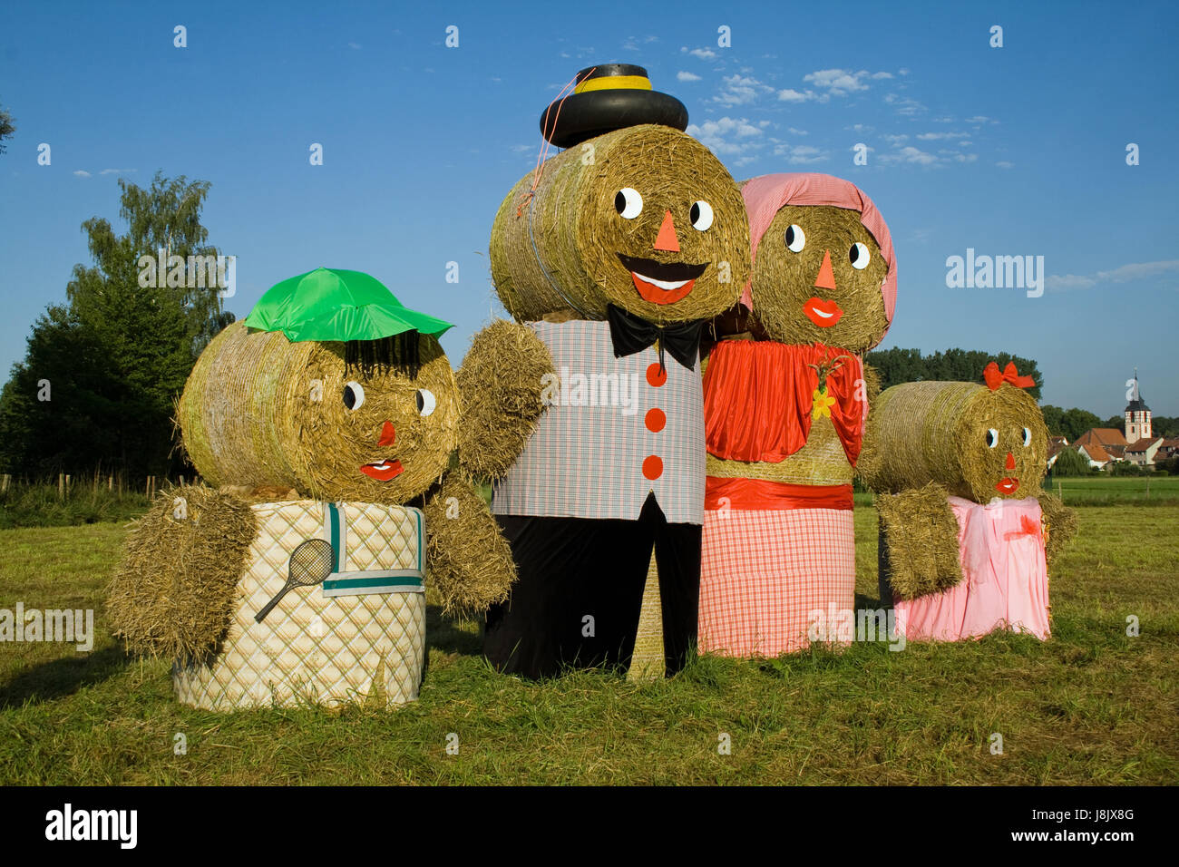 four characters from straw bales Stock Photo - Alamy