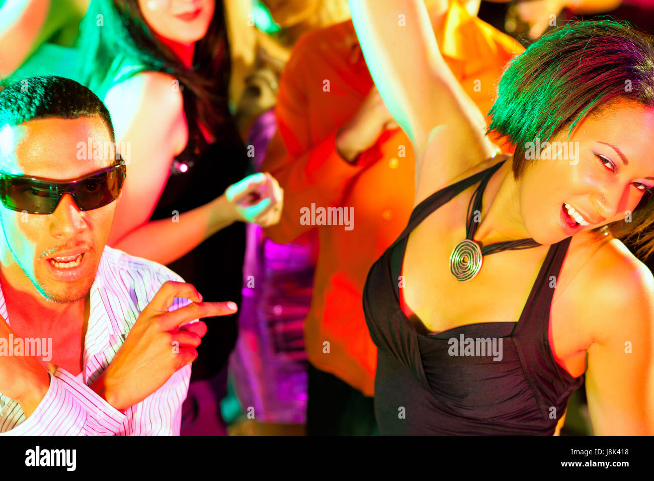 friends dancing in disco or club Stock Photo - Alamy