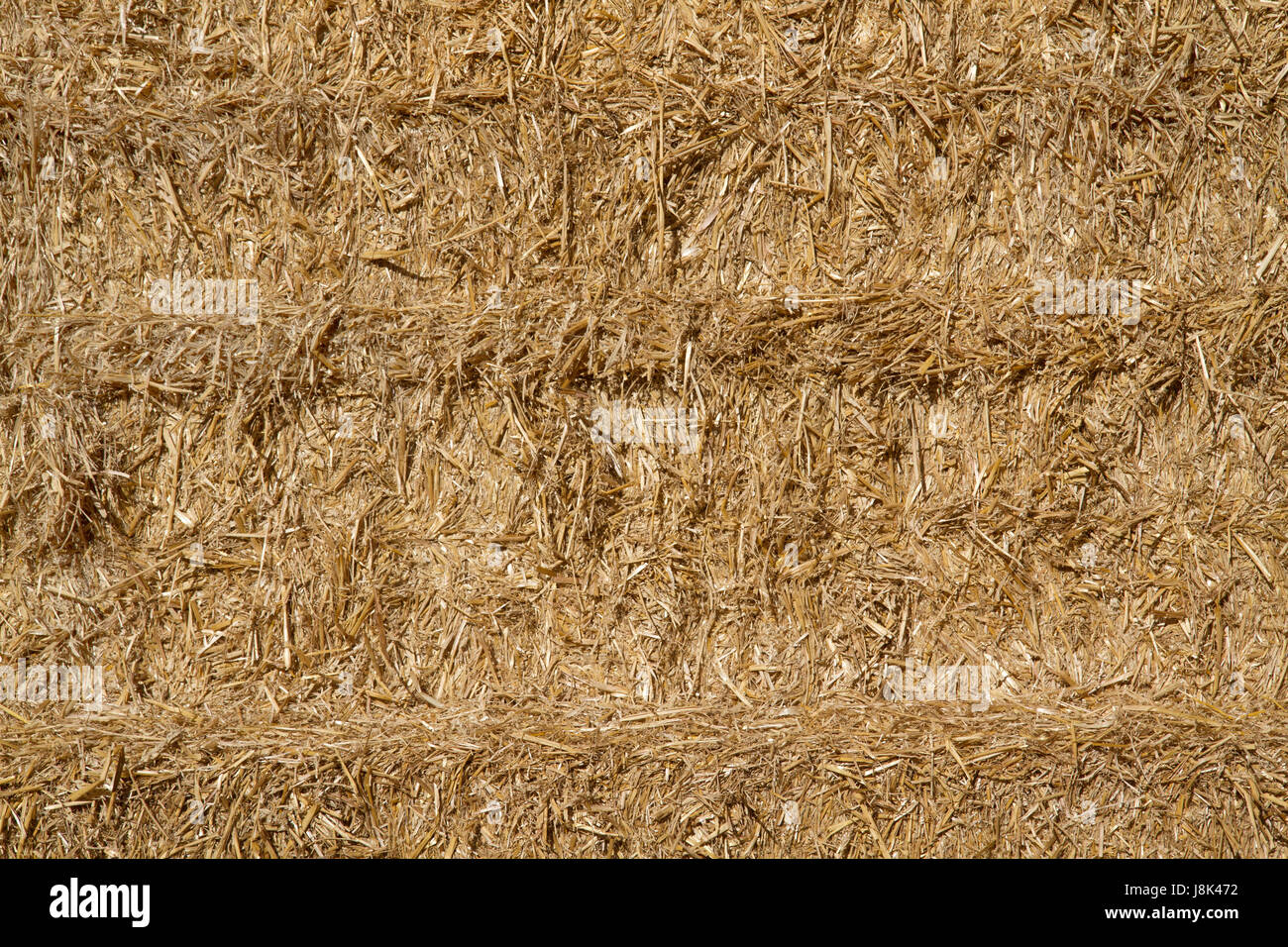 pressed straw bales as background Stock Photo - Alamy