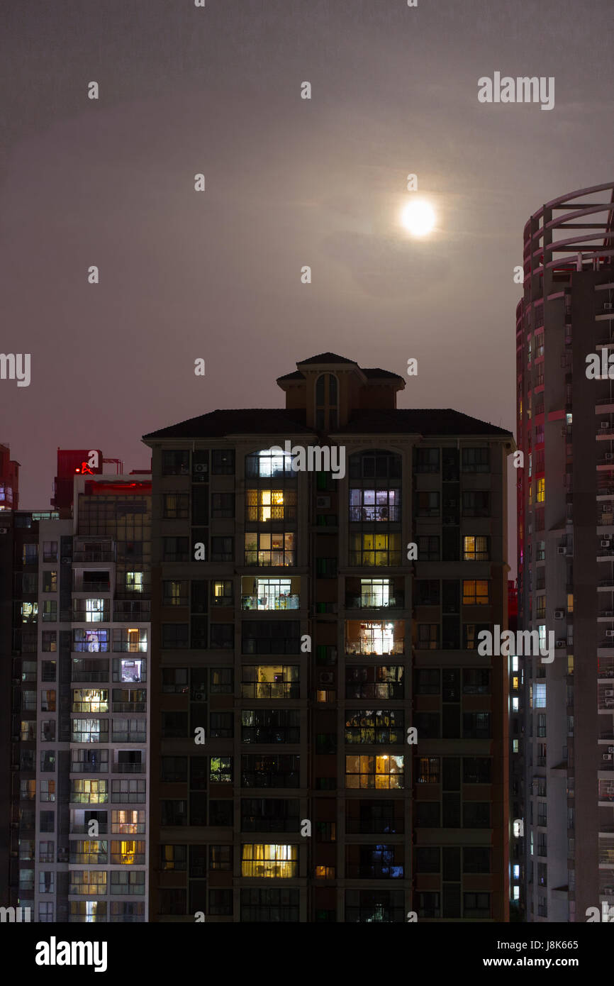 The city building in the moonlight Stock Photo - Alamy