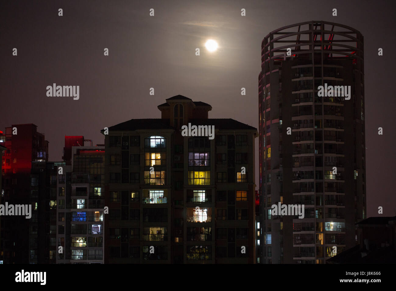 The city building in the moonlight Stock Photo - Alamy