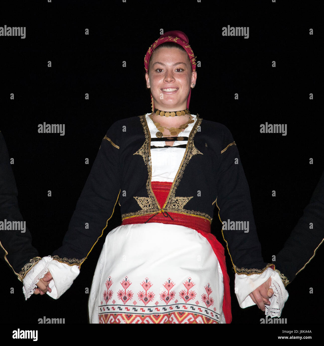 Greek woman dancing in traditional costume in old town Chania on the ...