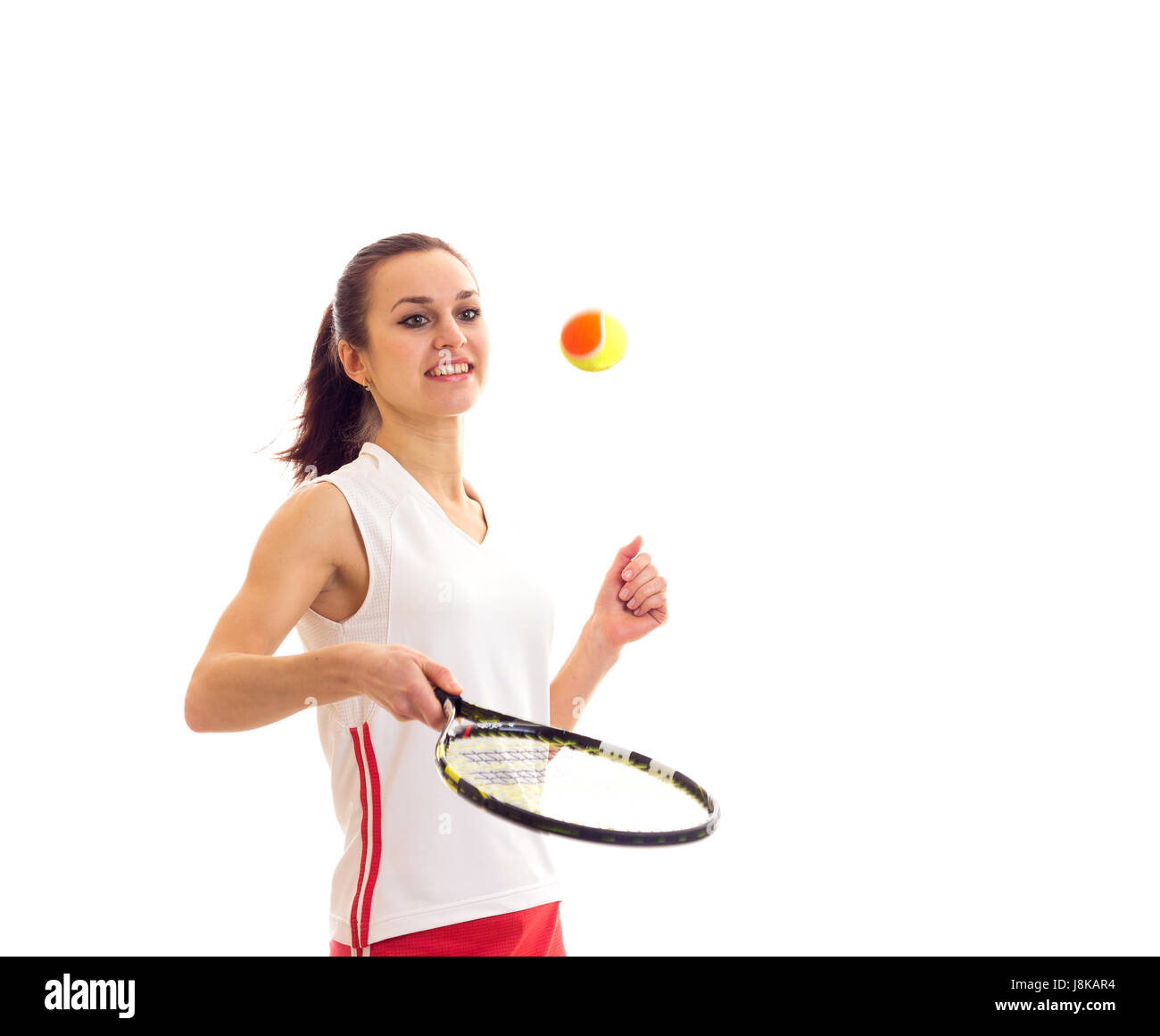 Woman playing with tennis racquet Stock Photo - Alamy