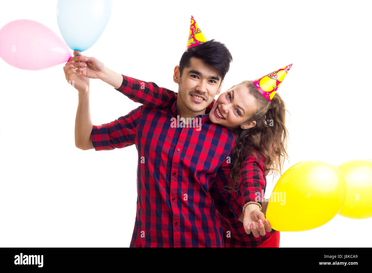 Young couple with balloons Stock Photo - Alamy