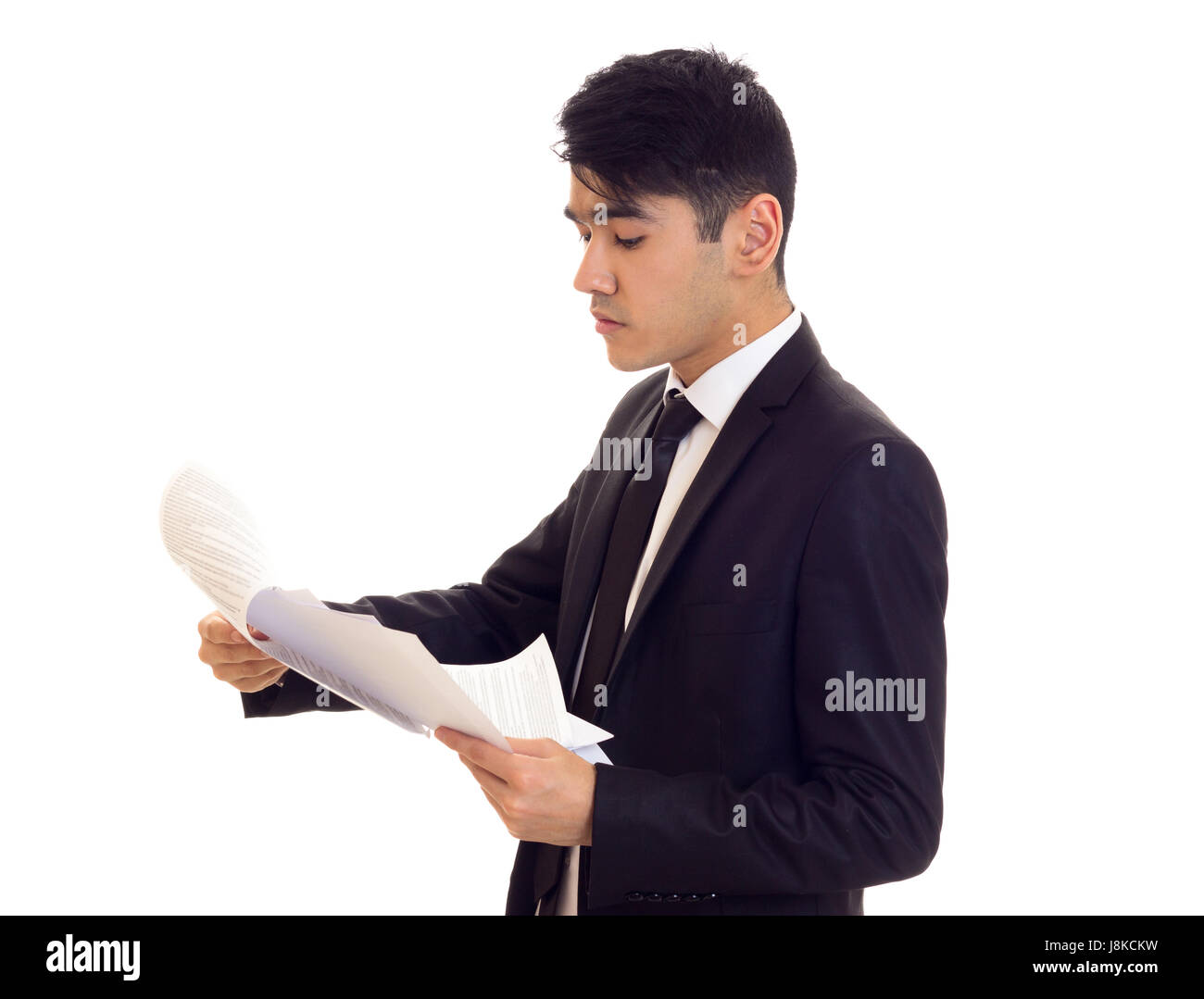 Young man in suit holding papers Stock Photo - Alamy