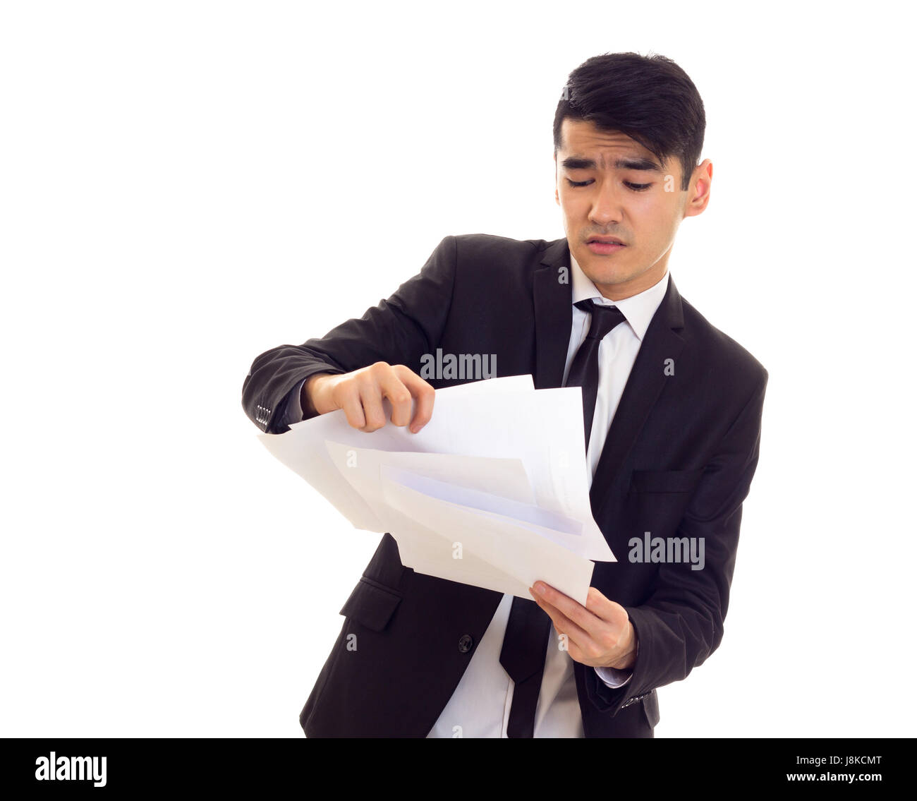Young man in suit holding papers Stock Photo - Alamy