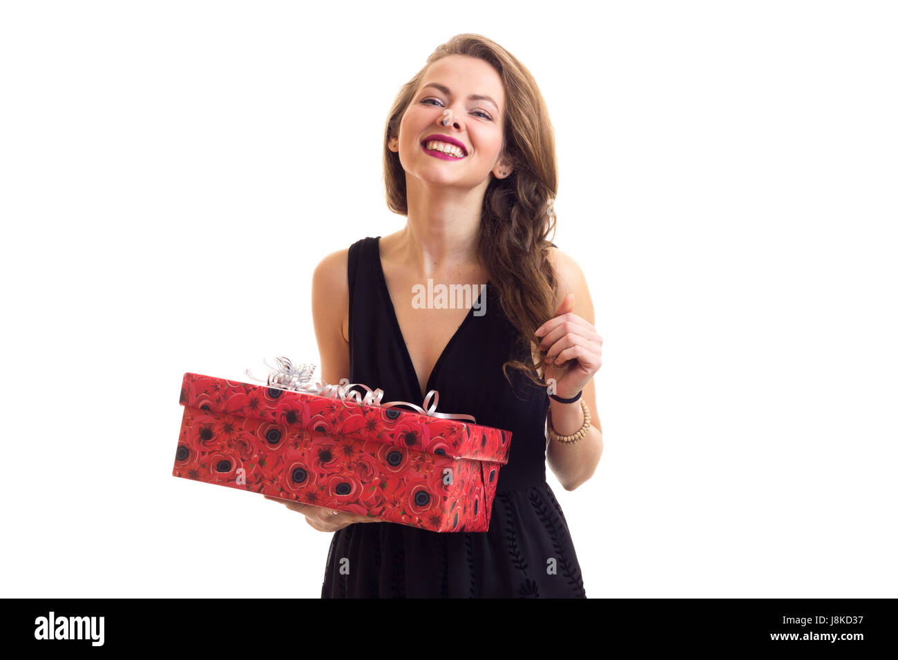 Young woman holding a present Stock Photo - Alamy