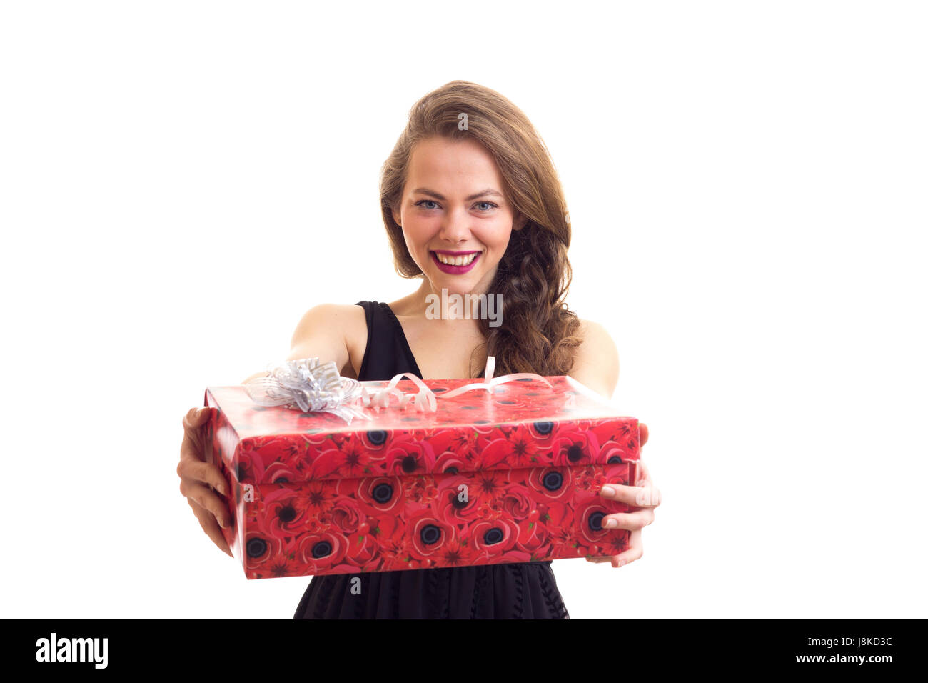 Young woman holding a present Stock Photo - Alamy