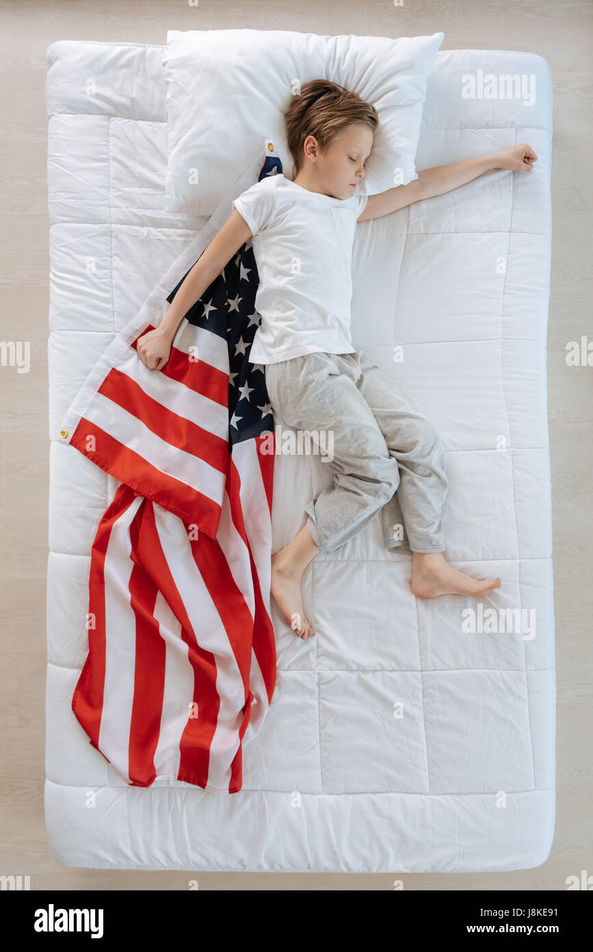 I am a superhero. Pleasant nice cute boy sleeping and dreaming of being ...