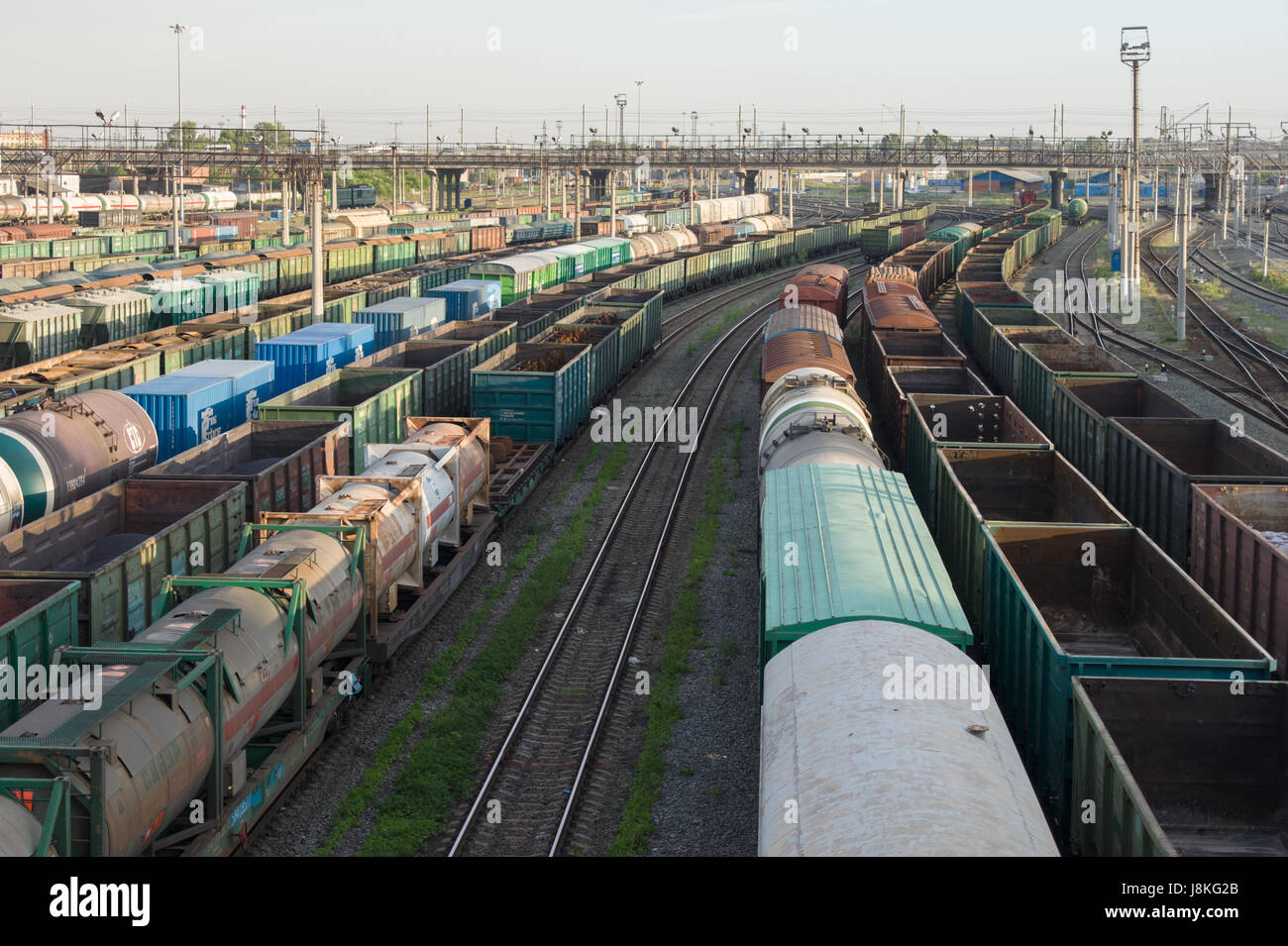 long trains with industrial goods stand on the rails Stock Photo - Alamy