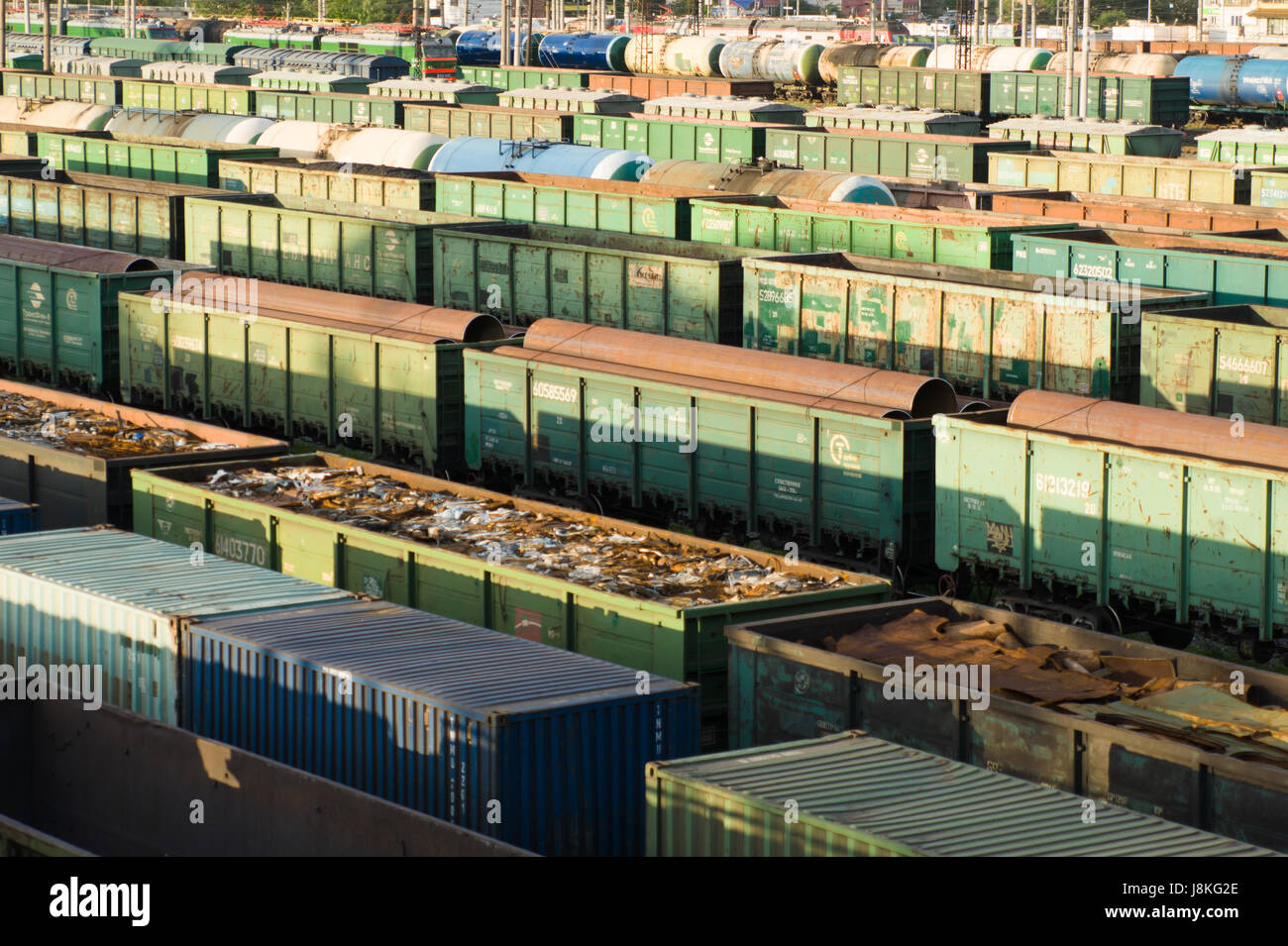 long trains with industrial goods stand on the rails Stock Photo - Alamy