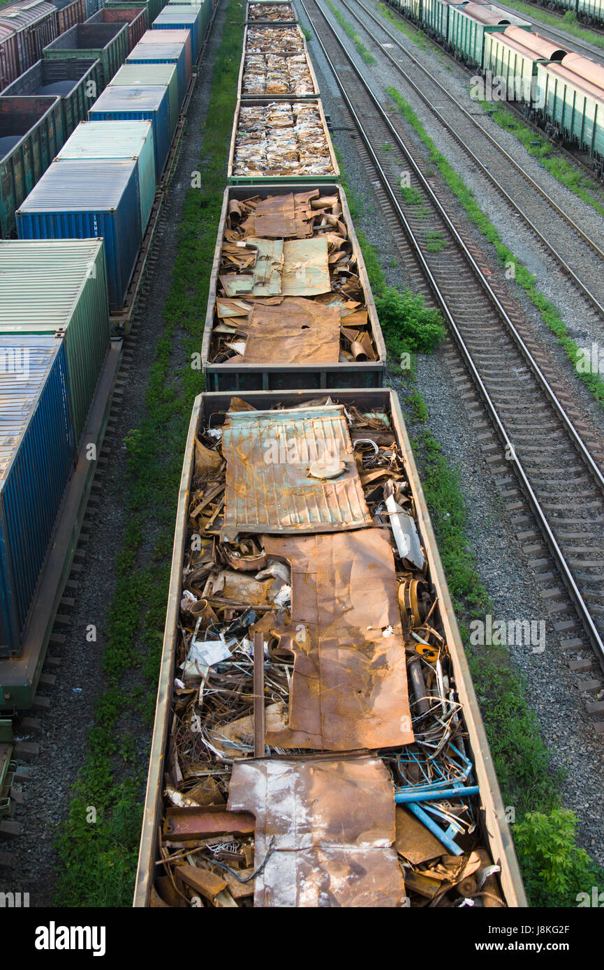 long trains with industrial goods stand on the rails Stock Photo - Alamy