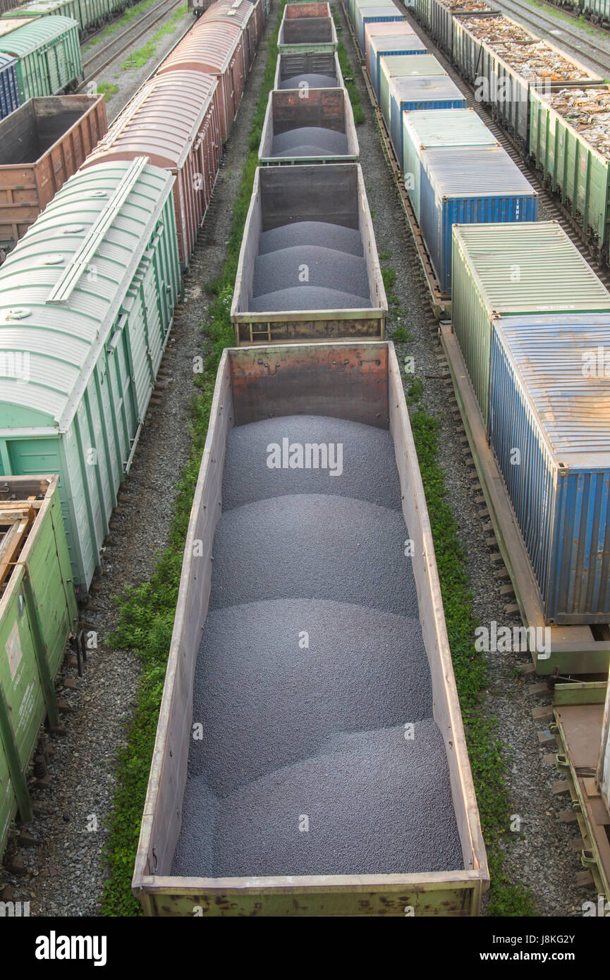 long trains with industrial goods stand on the rails Stock Photo - Alamy