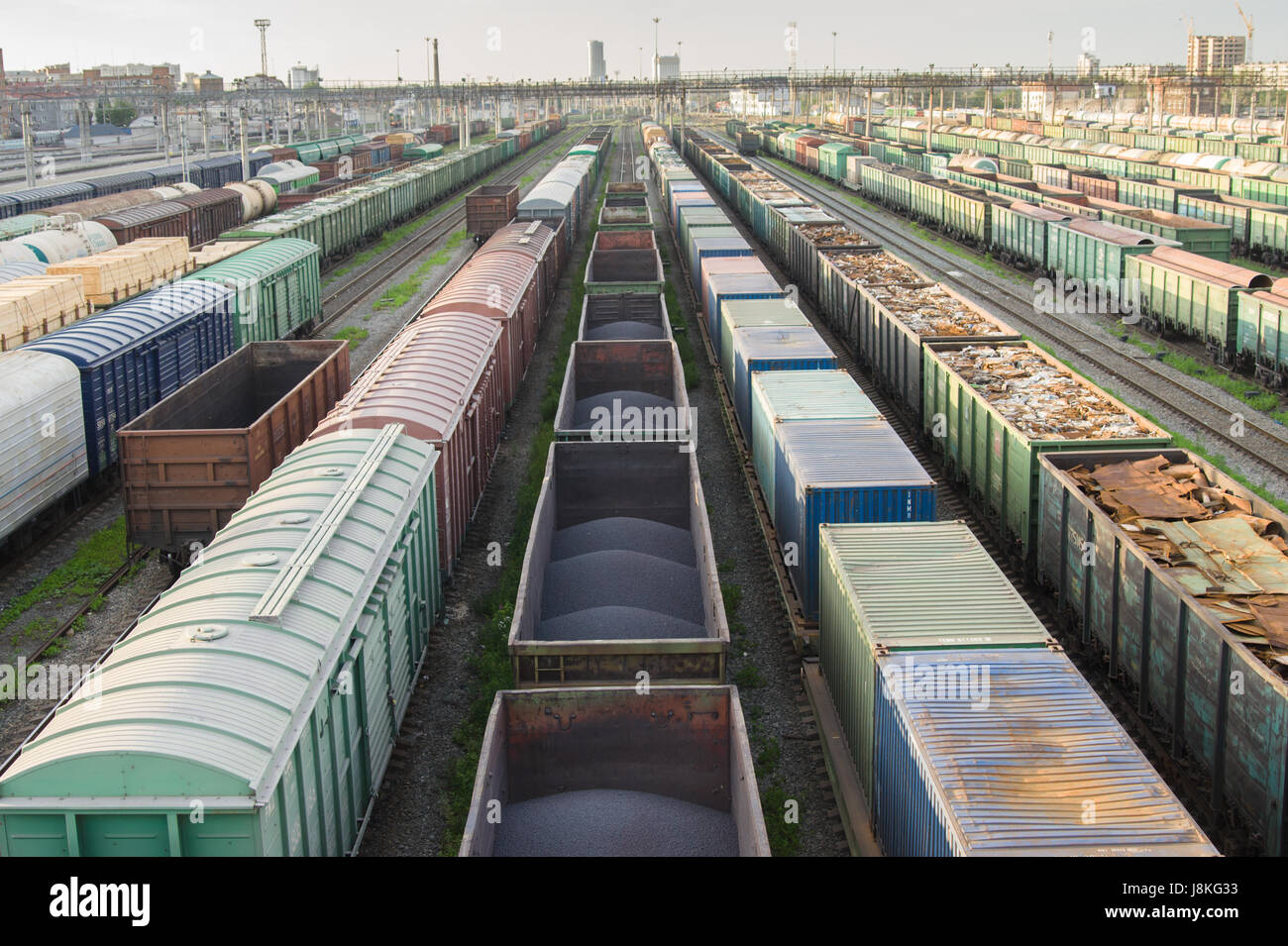 long trains with industrial goods stand on the rails Stock Photo - Alamy
