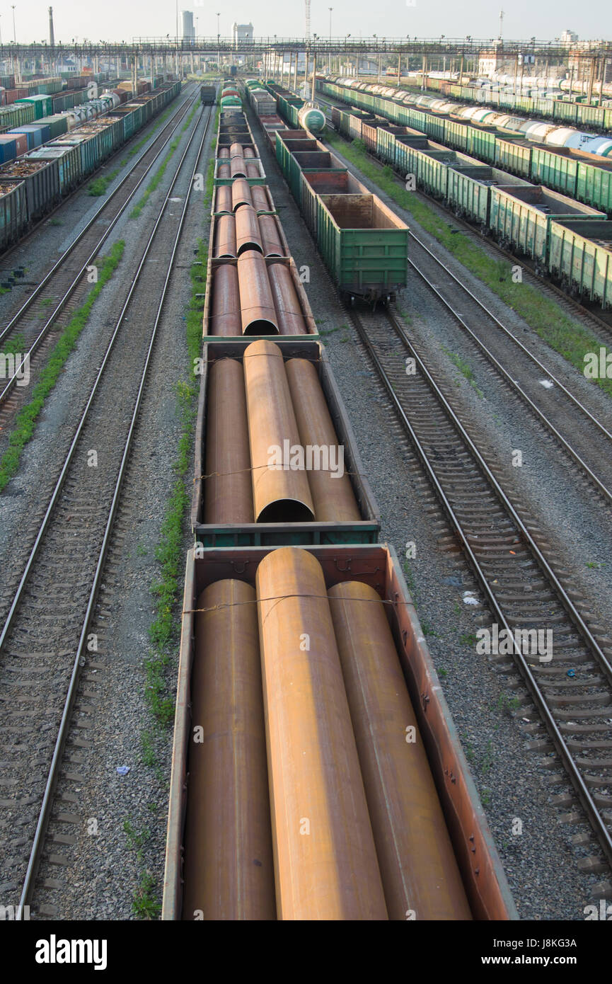 long trains with industrial goods stand on the rails Stock Photo - Alamy