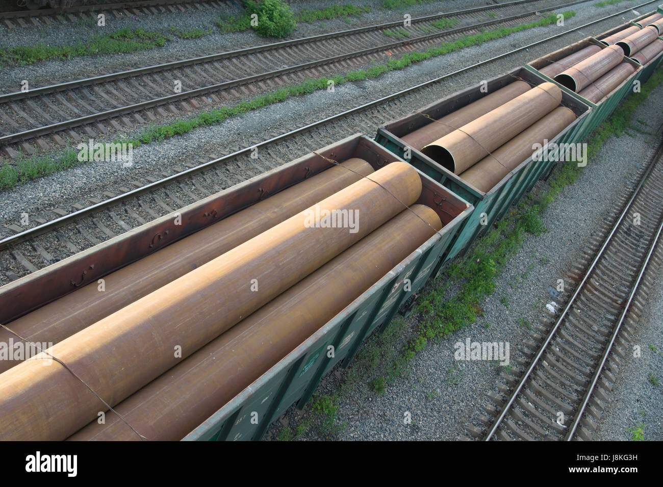 long trains with industrial goods stand on the rails Stock Photo - Alamy