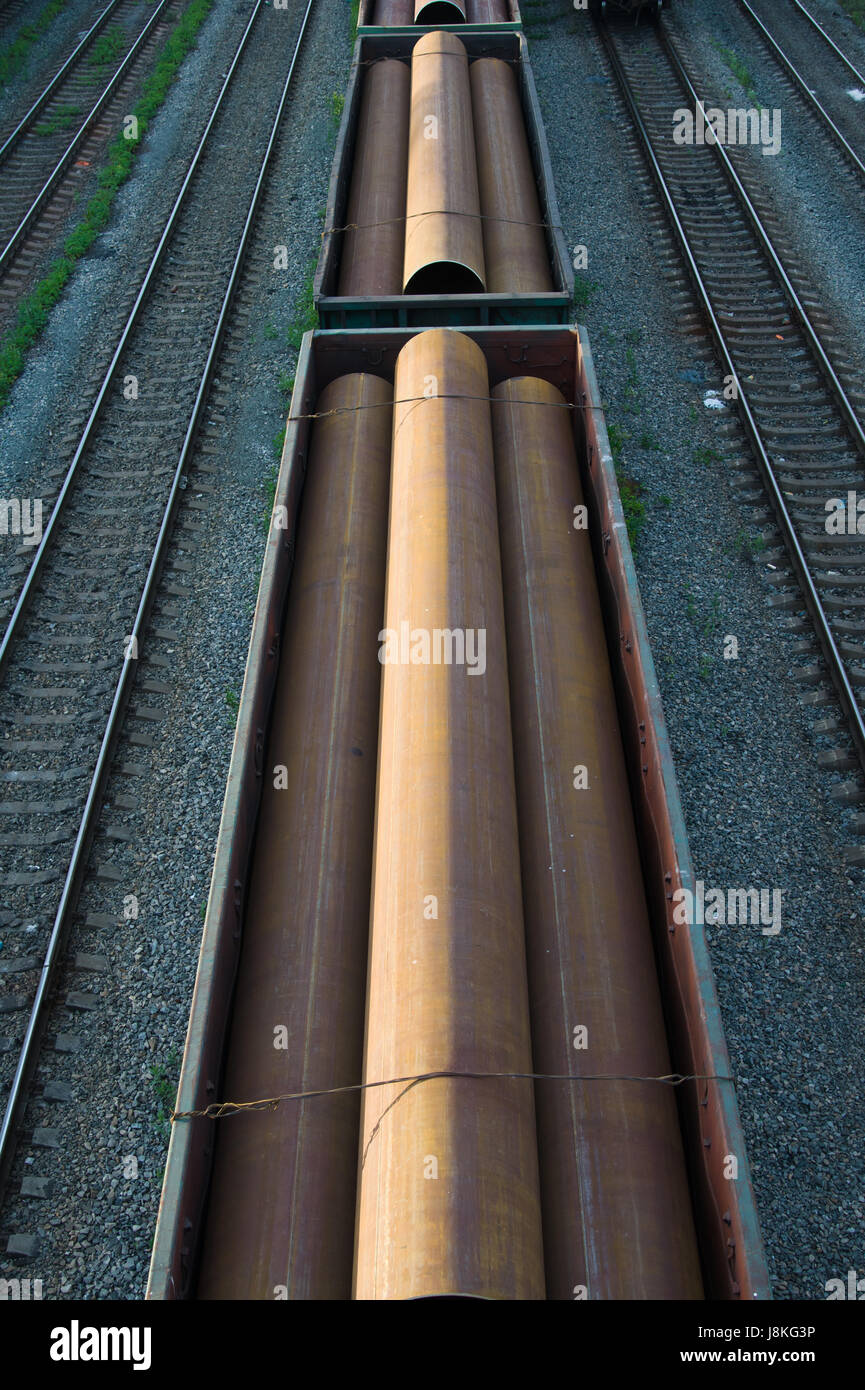 long trains with industrial goods stand on the rails Stock Photo - Alamy