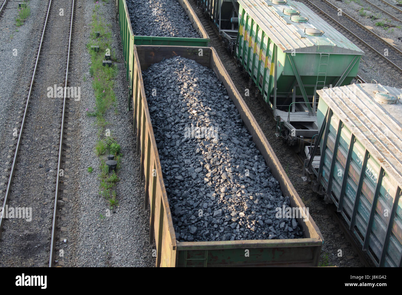 long trains with industrial goods stand on the rails Stock Photo - Alamy