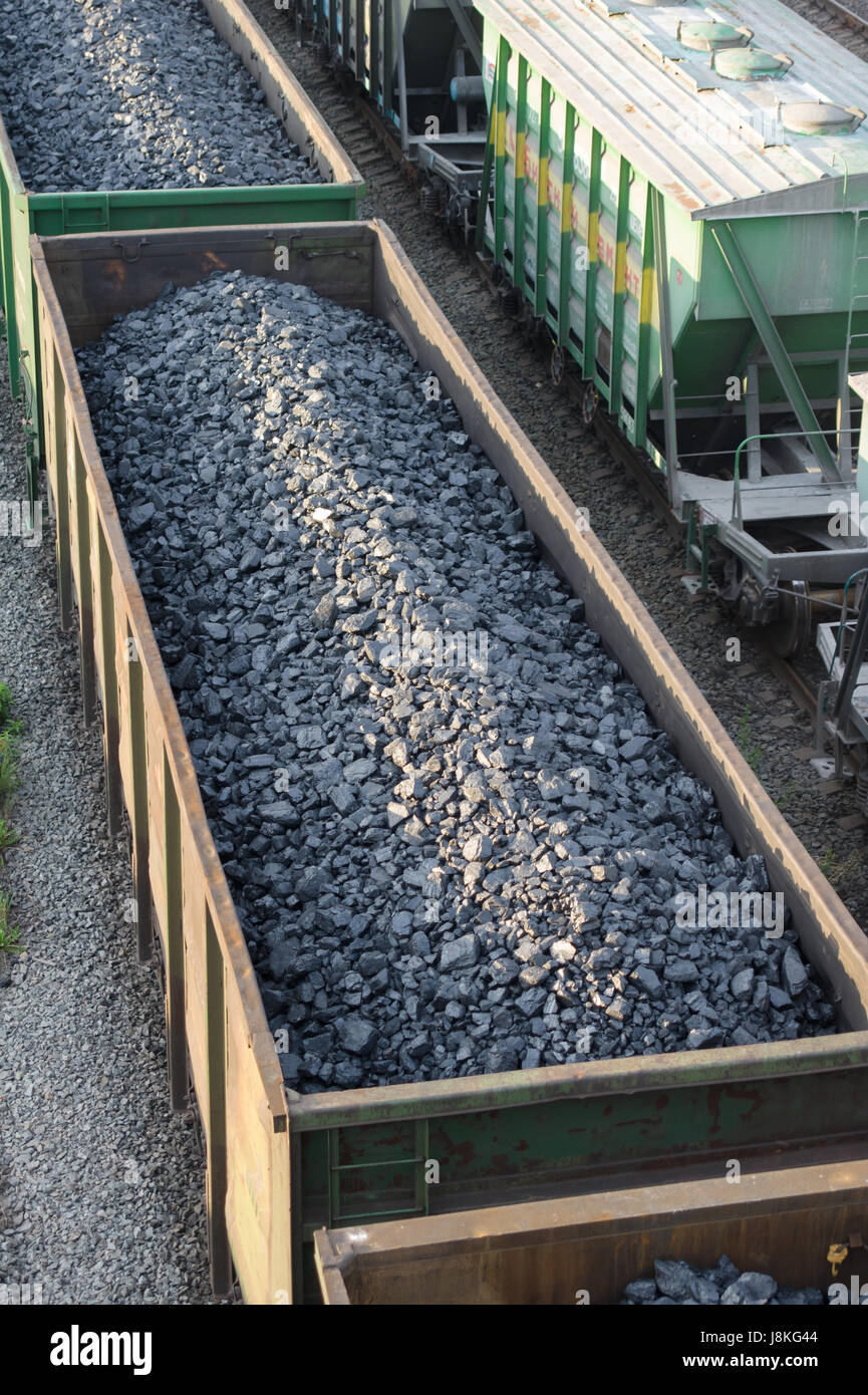 long trains with industrial goods stand on the rails Stock Photo - Alamy