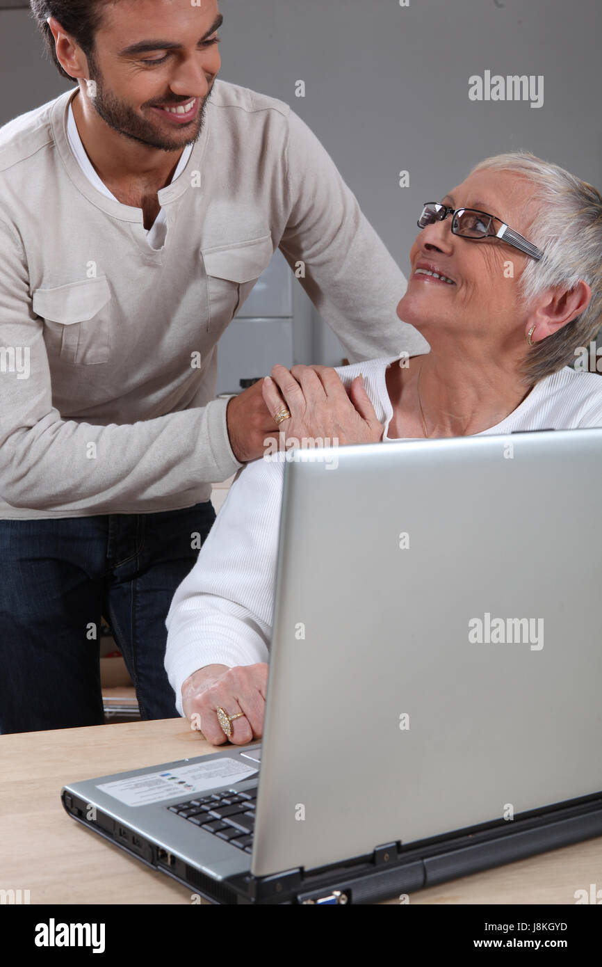 Boy old man computer help hi-res stock photography and images - Alamy