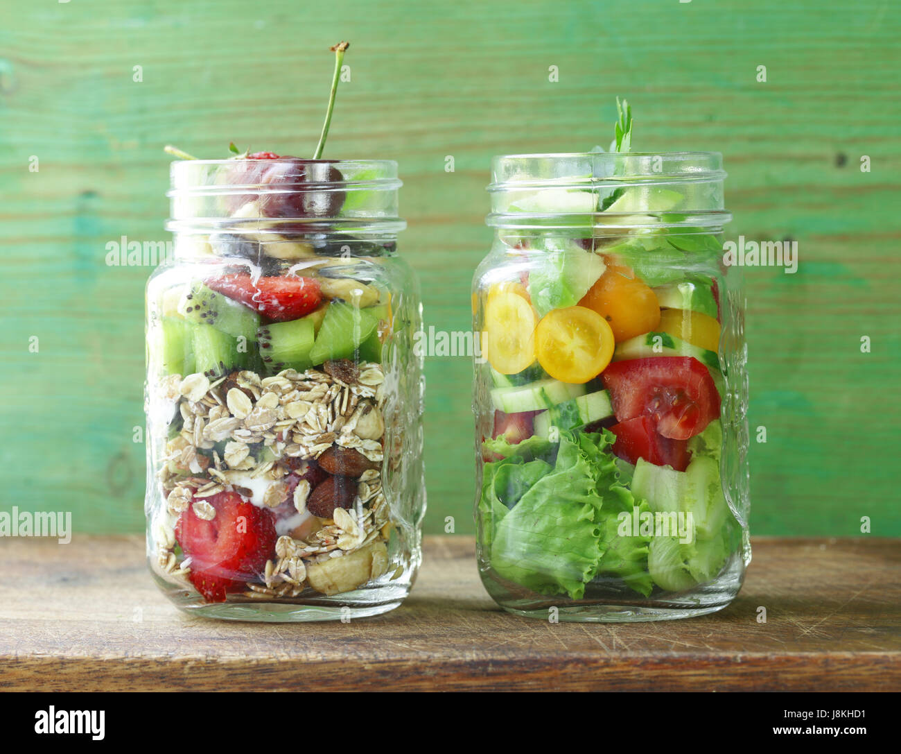 homemade granola and vegetable salad in a glass jars Stock Photo - Alamy