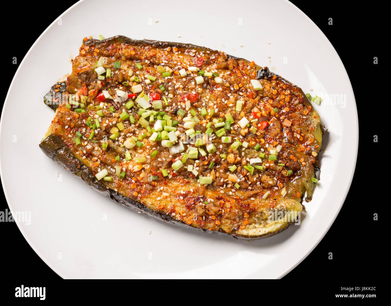 A Plate of Chinese BBQ on Black Background. Eggplant Stock Photo - Alamy