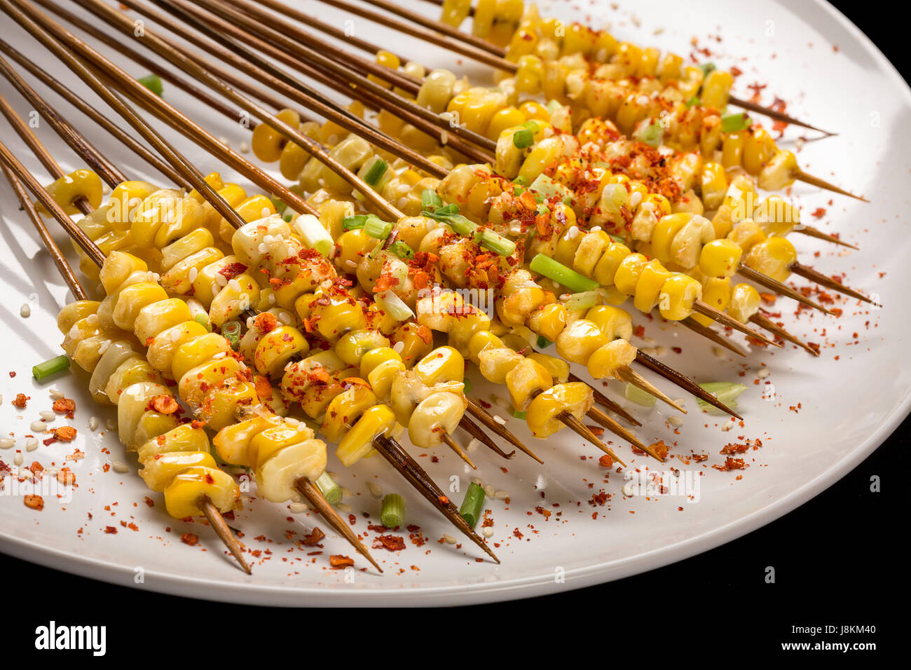 A Plate of Chinese BBQ on Black Background.Corn Stock Photo - Alamy