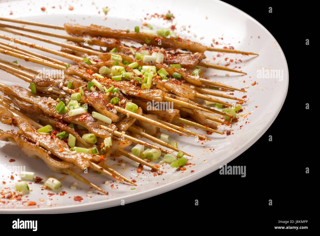 A Plate of Chinese BBQ on Black Background Stock Photo - Alamy