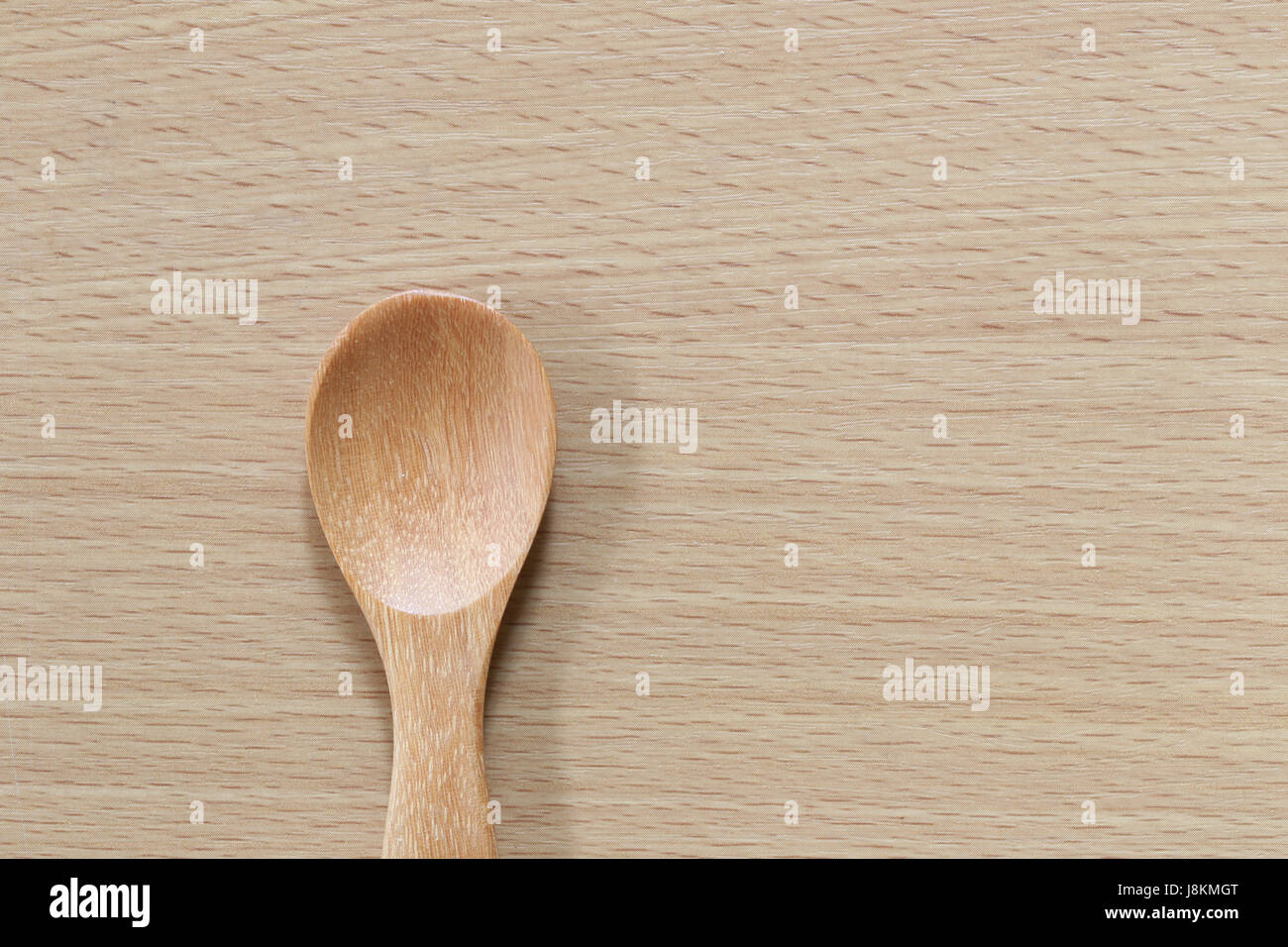 Empty wooden spoon on wood floor in food design concept Stock Photo - Alamy