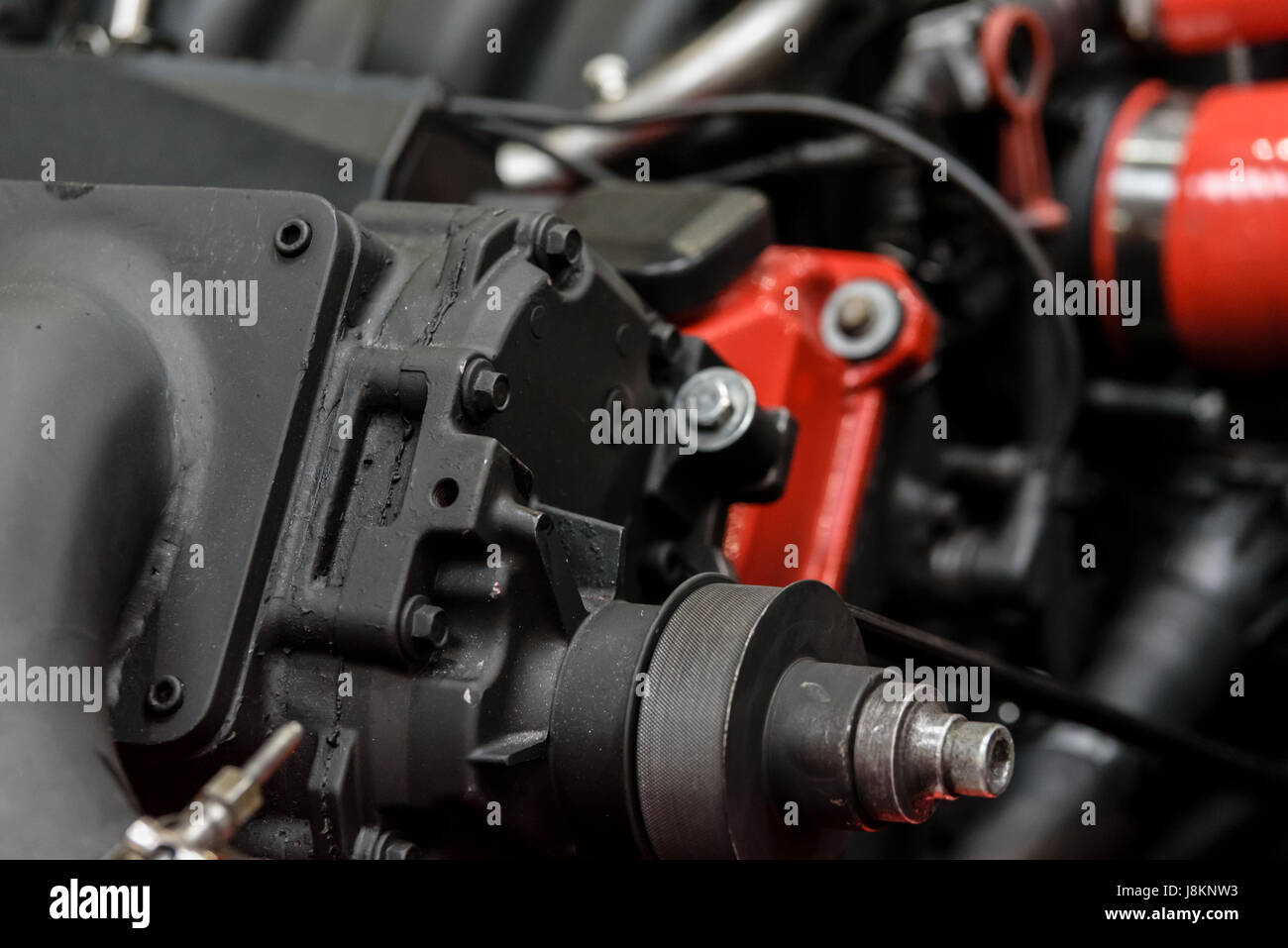 Closeup on a part of a powerful sports car engine Stock Photo - Alamy