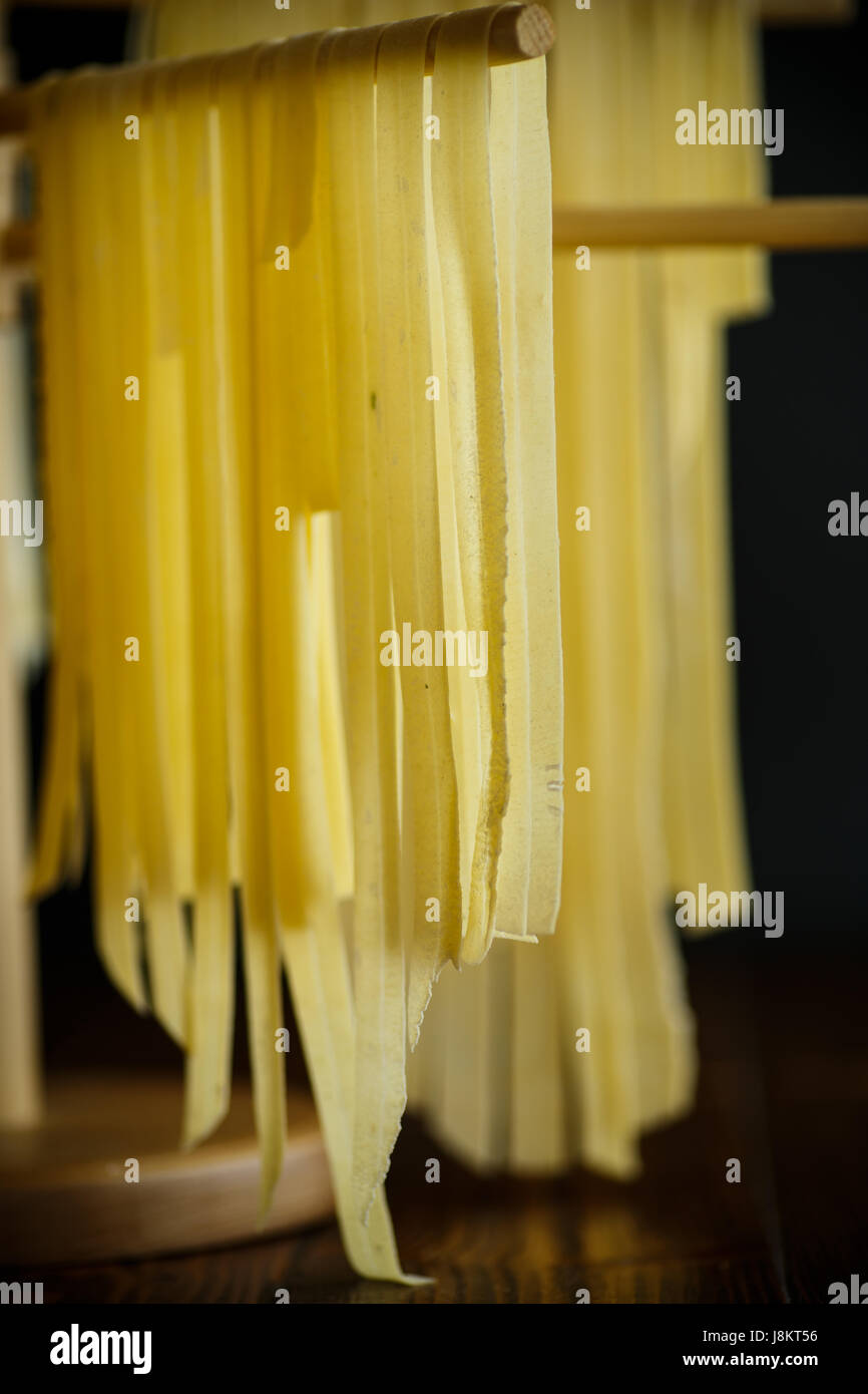 Home-made noodles are dried Stock Photo - Alamy