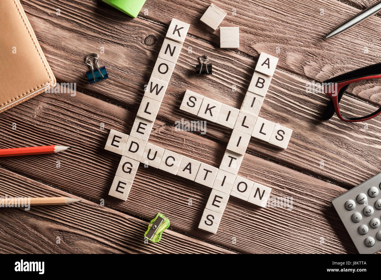 Conceptual keywords on wooden table with elements of game making ...