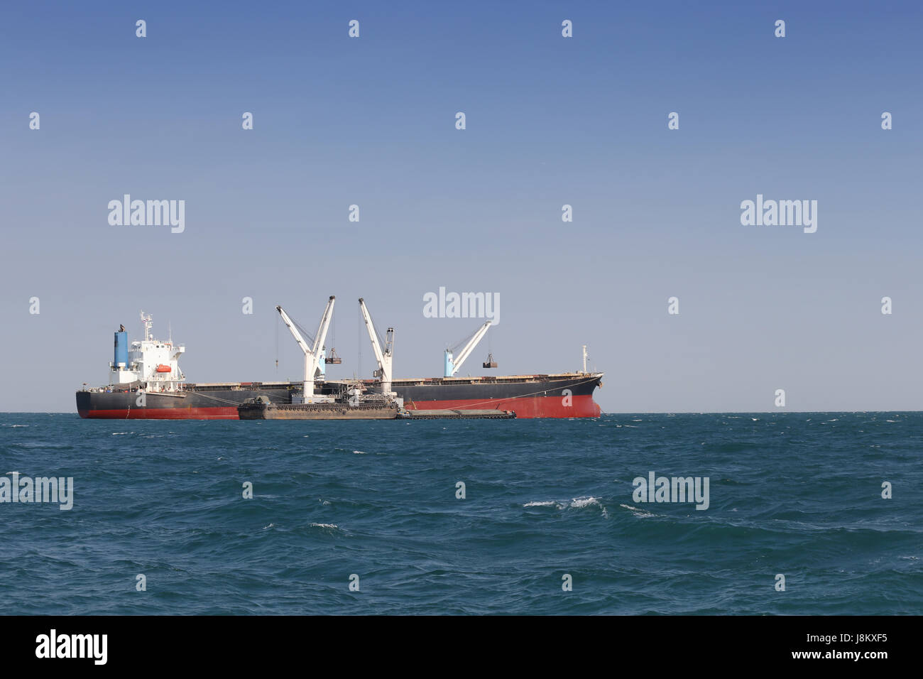 cargo ship in the sea,daytime sky Stock Photo - Alamy