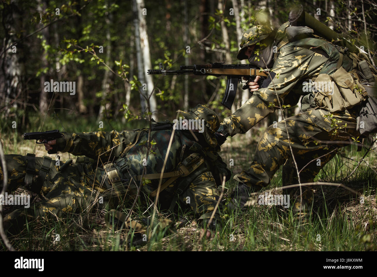 The soldier saves his comrade in battle Stock Photo - Alamy