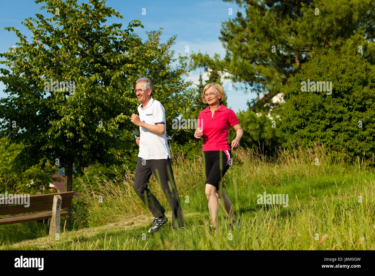 elderly couple jogging Stock Photo - Alamy