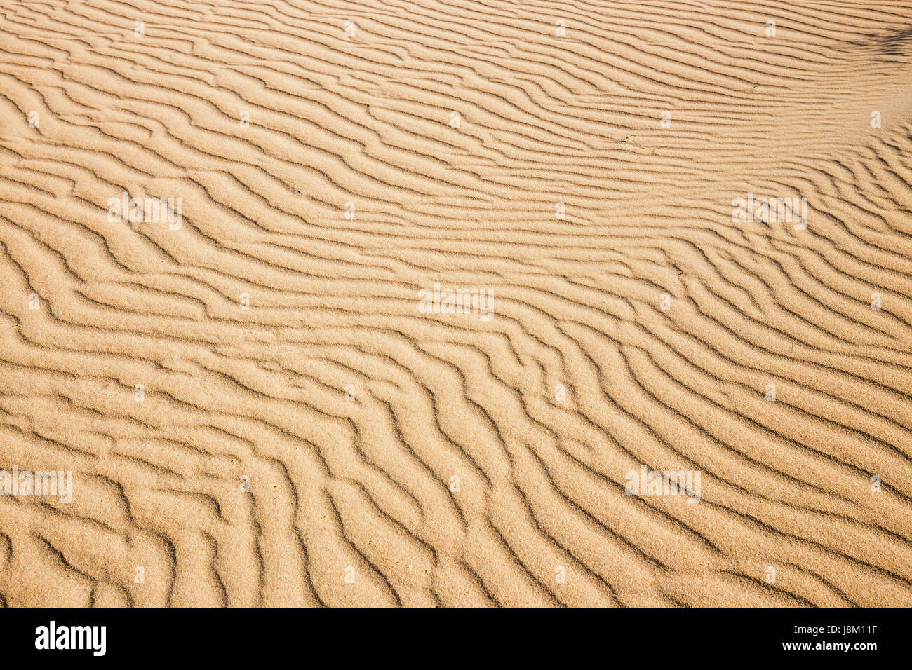 Lines in the sand of a beach, close up Stock Photo - Alamy