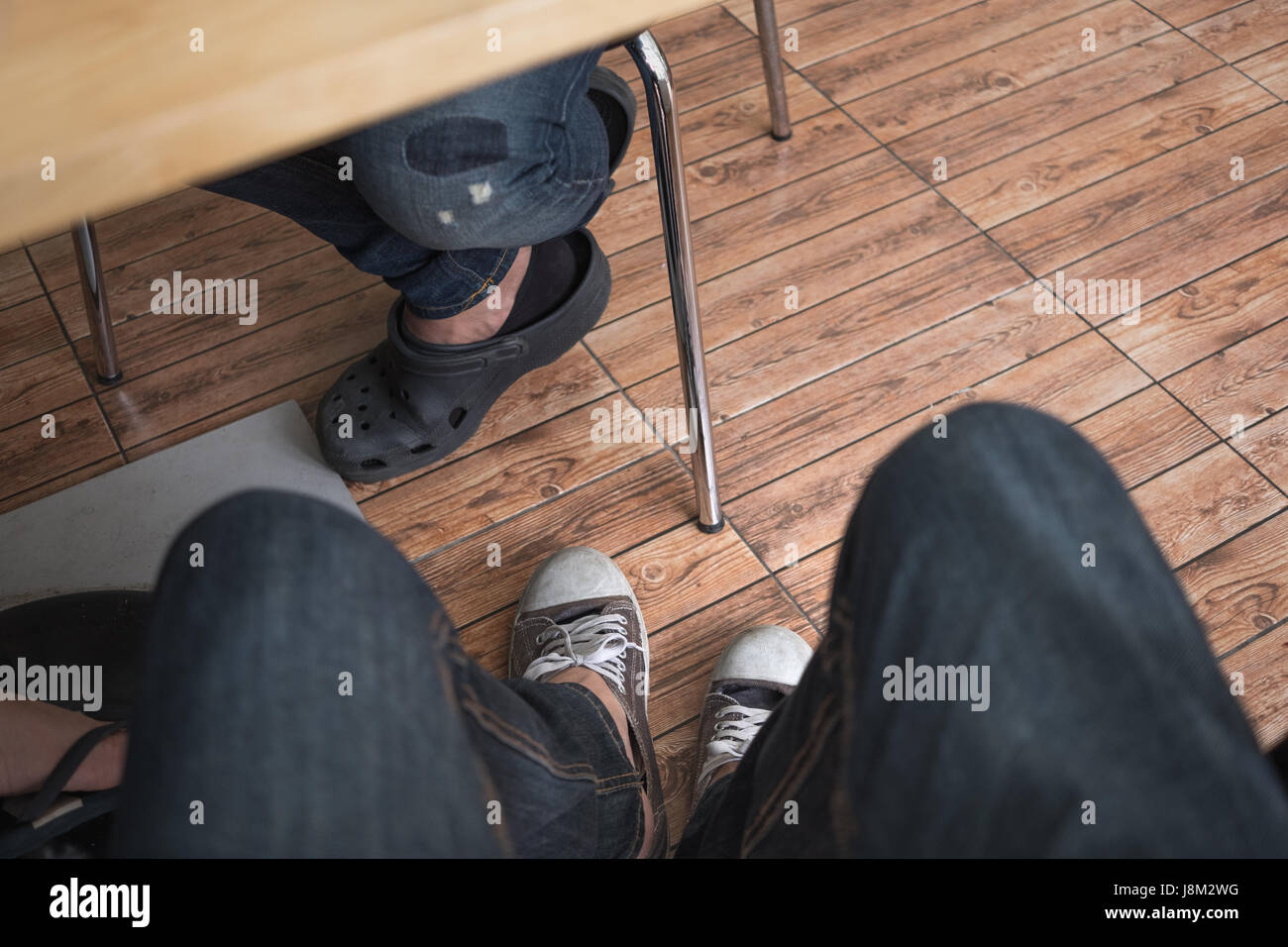 Legs of people sitting and waiting concept Stock Photo - Alamy