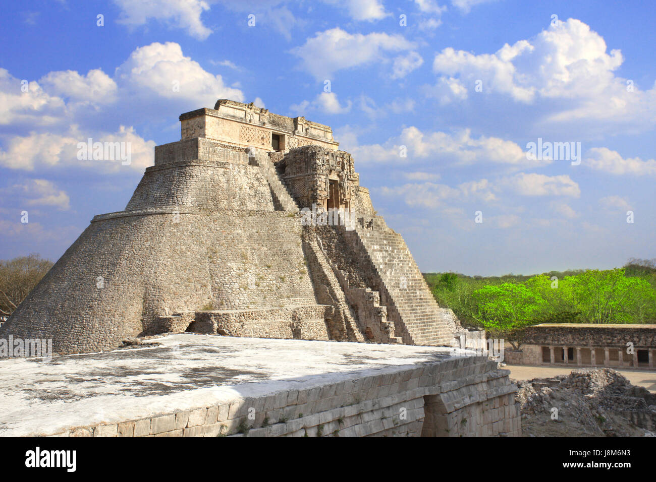 Ancient Mayan pyramid of the Magician in Uxmal with god Chaac masks ...