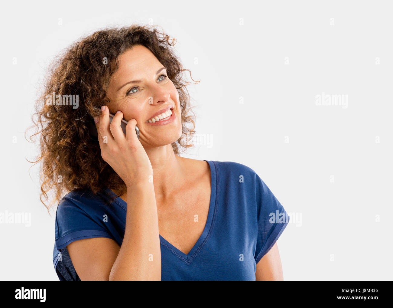 Beautiful young woman with mobile phone making a phone call Stock Photo ...
