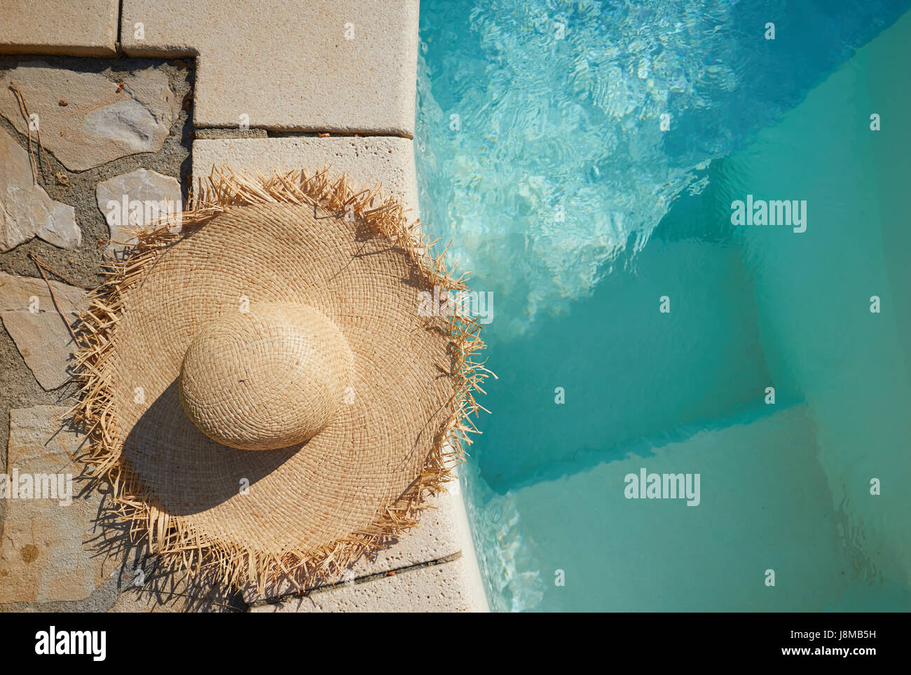 hat by a swimming pool. Backgroud concept Stock Photo - Alamy