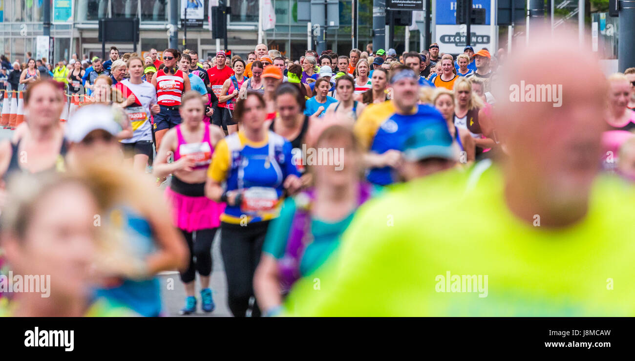 Wide angle of runners filling the frame on the streets of Liverpool ...