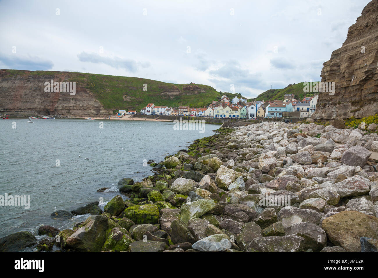 A view of the harbour and seafront at Staithes,North Yorkshire,England ...