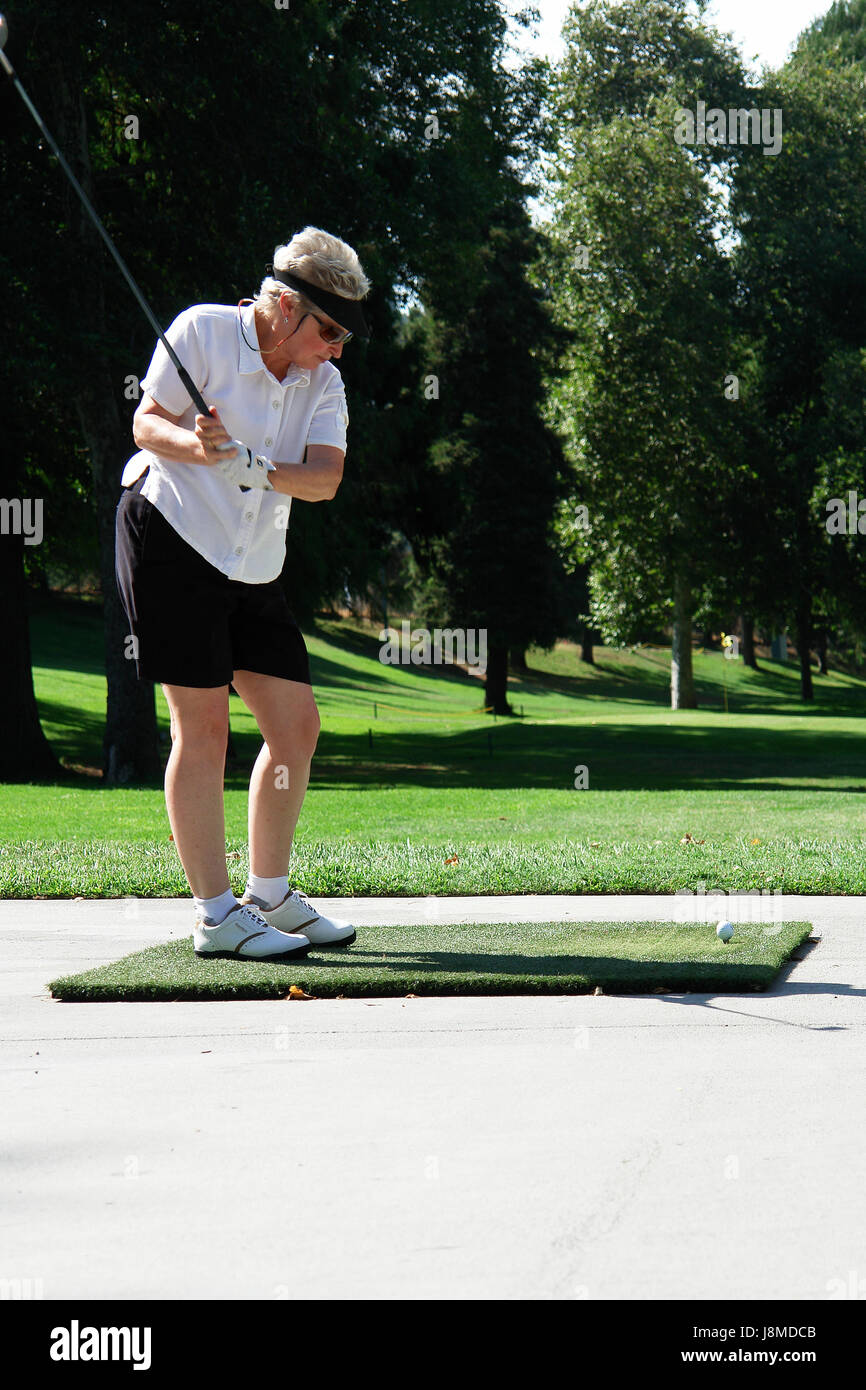 Golfers practicing driving range hi-res stock photography and images ...