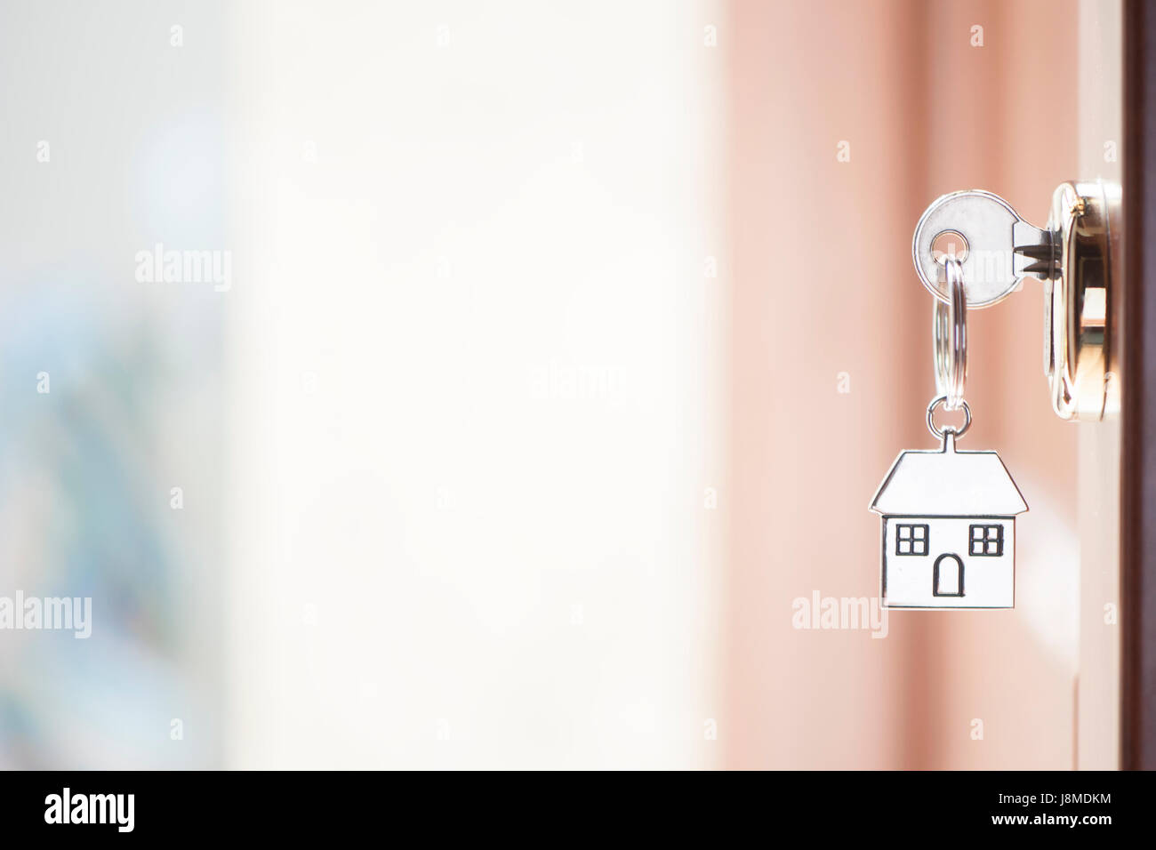 House key in the door Stock Photo - Alamy