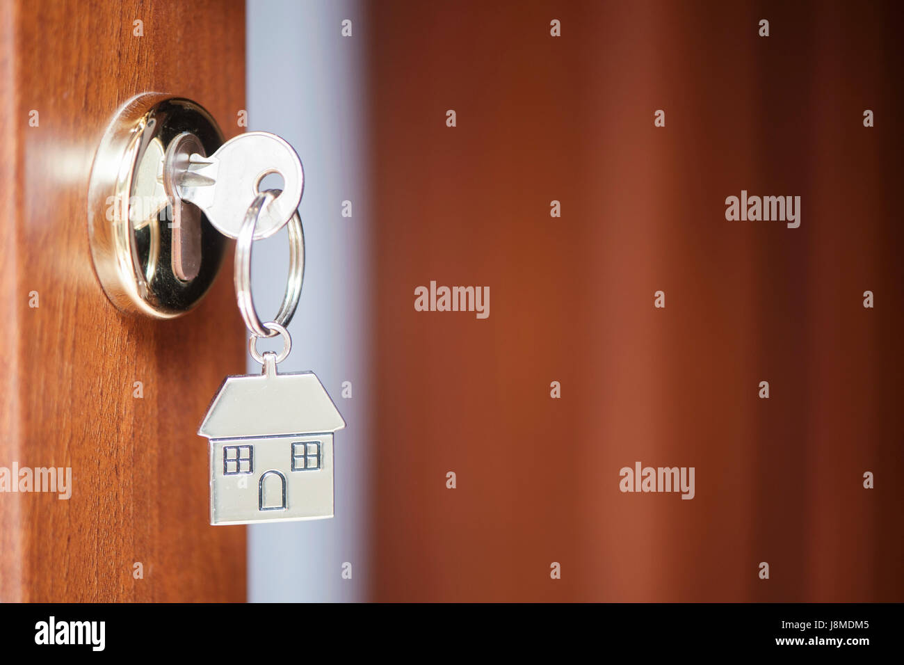 House key in the door Stock Photo - Alamy